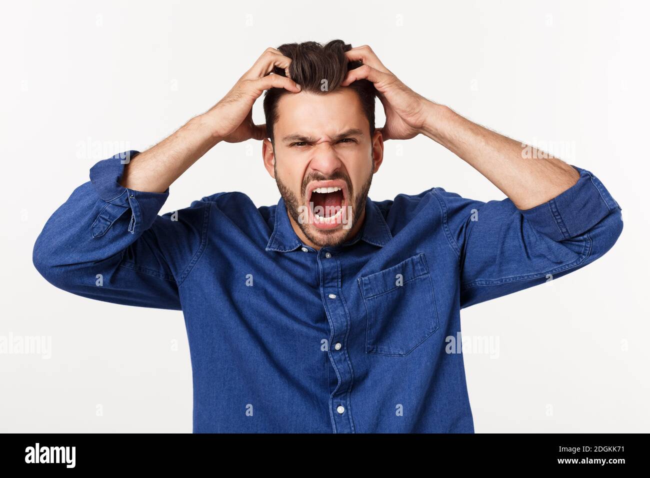 Young office worker mad by stress screaming isolated on white Stock ...