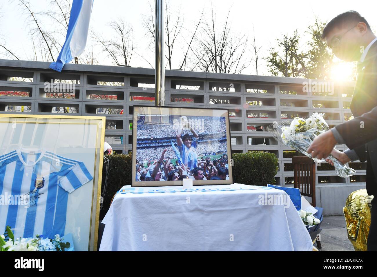 A football fan pays tribute to the memorial stall for late Argentine ...