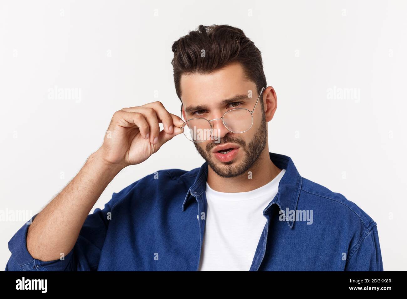 Charming handsome. Handsome young man in casual wear while standing ...