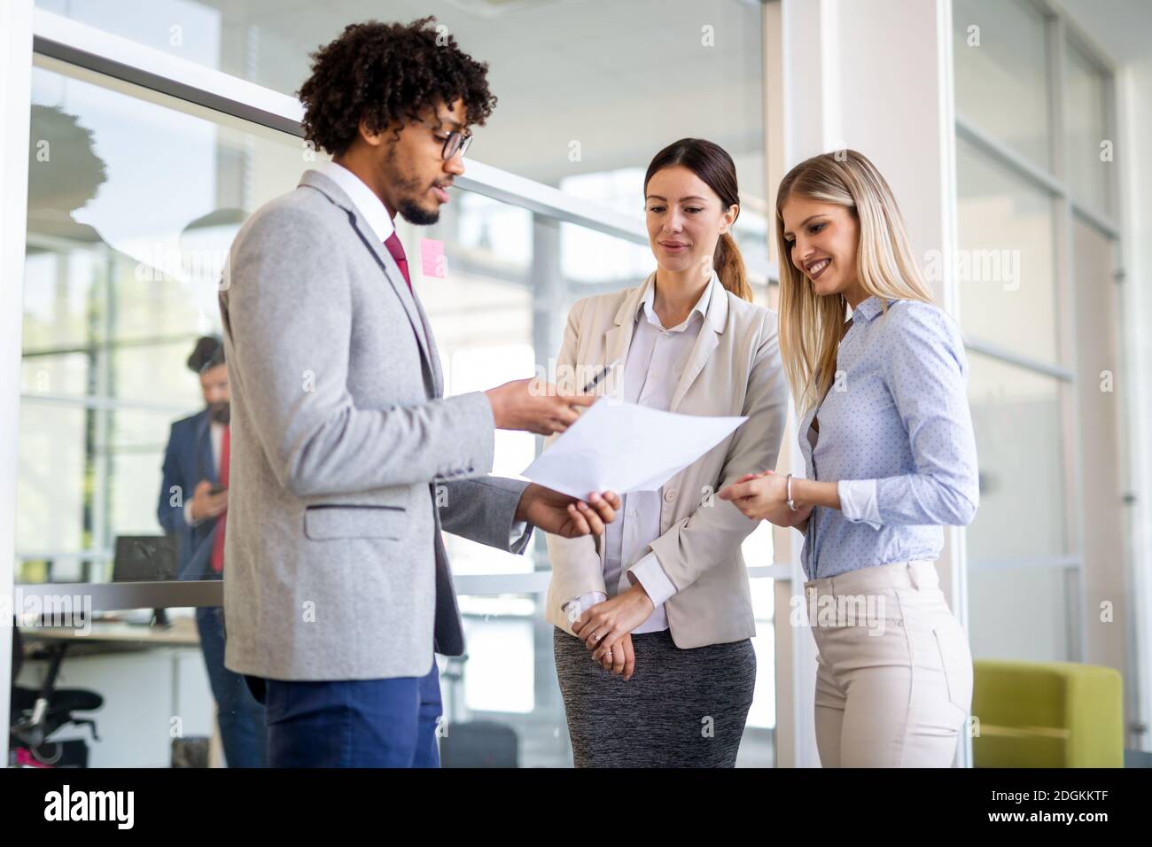 Group of coworkers working together on business project in modern ...