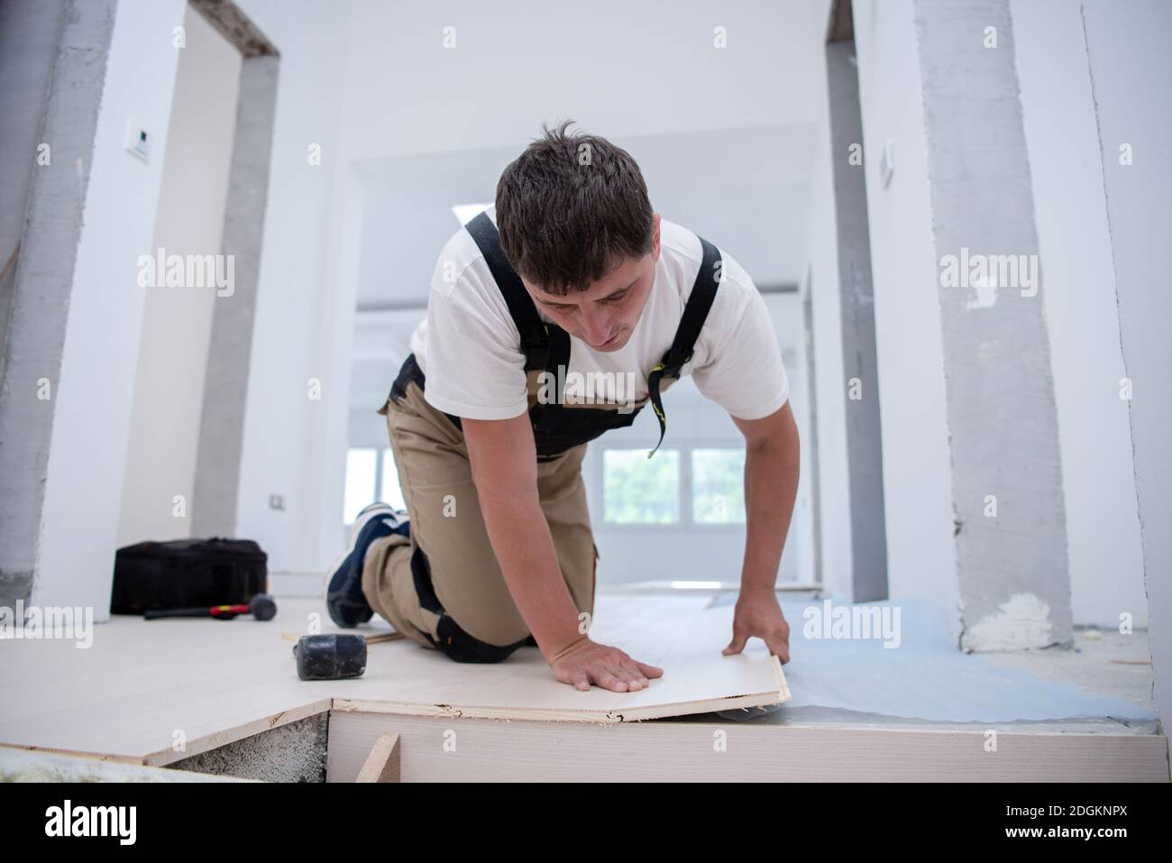 Worker Installing New Laminated Wooden Floor Stock Photo - Alamy