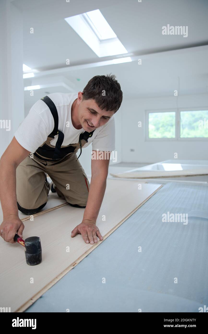 Professional Worker Installing New Laminated Wooden Floor Stock Photo ...