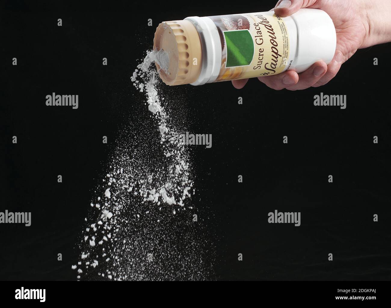 Icing Sugar Sprinkled against Black Background Stock Photo - Alamy