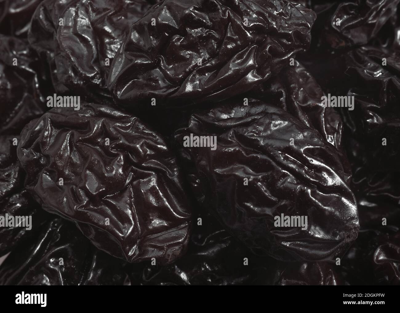 Dry Prunes against White Background Stock Photo - Alamy