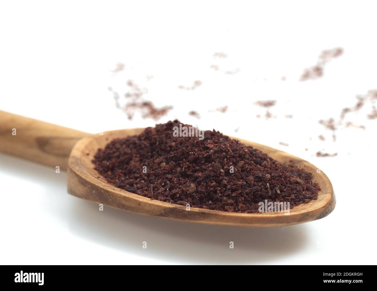 Sumac Powder, Spice in a Spoon against White Background Stock Photo - Alamy