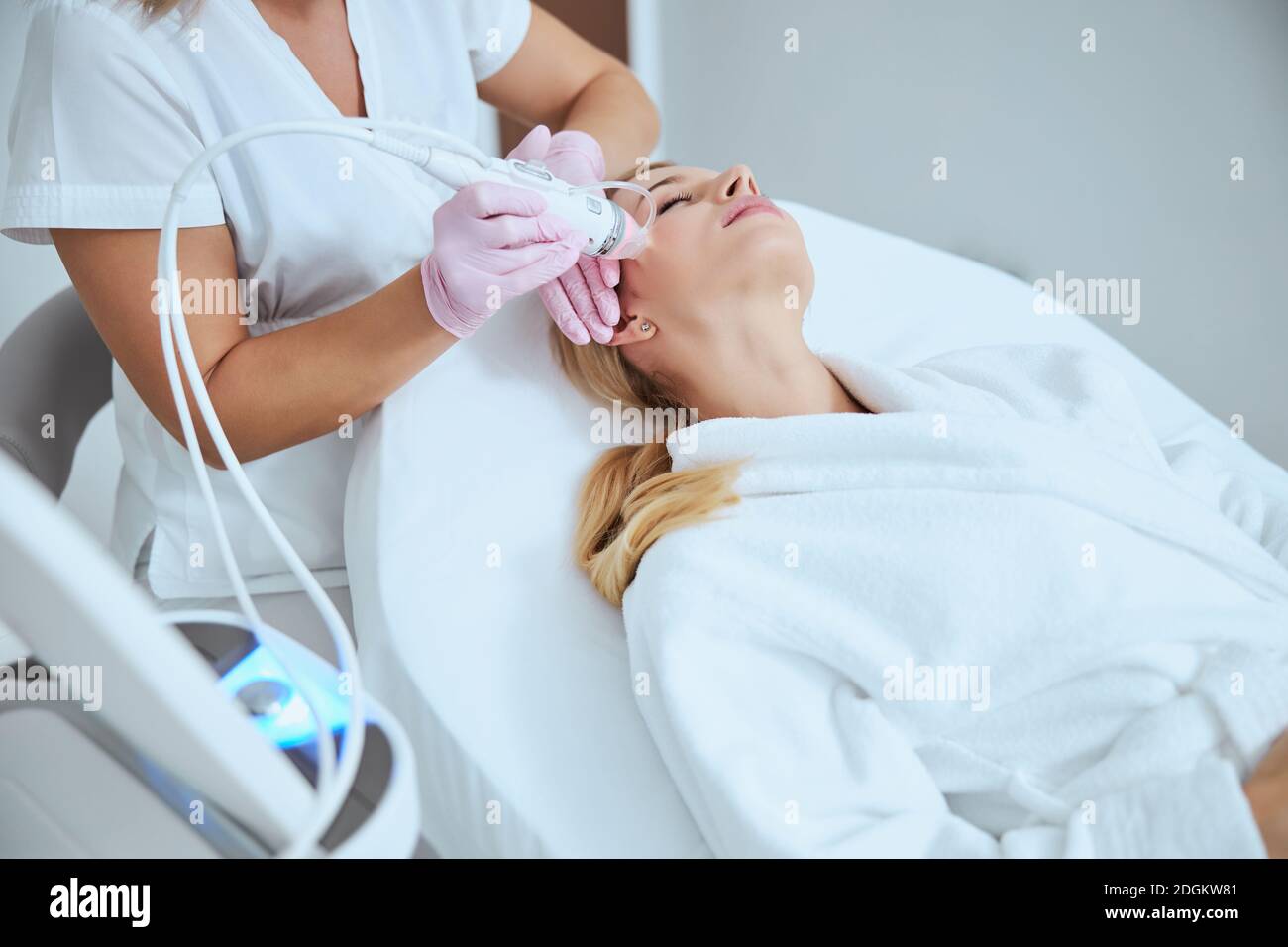 Blonde woman getting a skin tightening treatment Stock Photo - Alamy