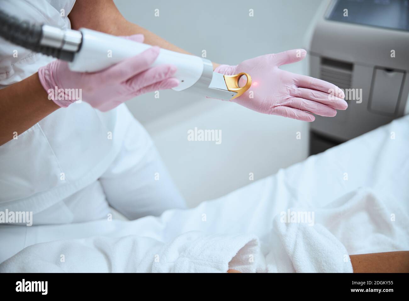 Dermatologist testing the beauty device before the procedure Stock ...