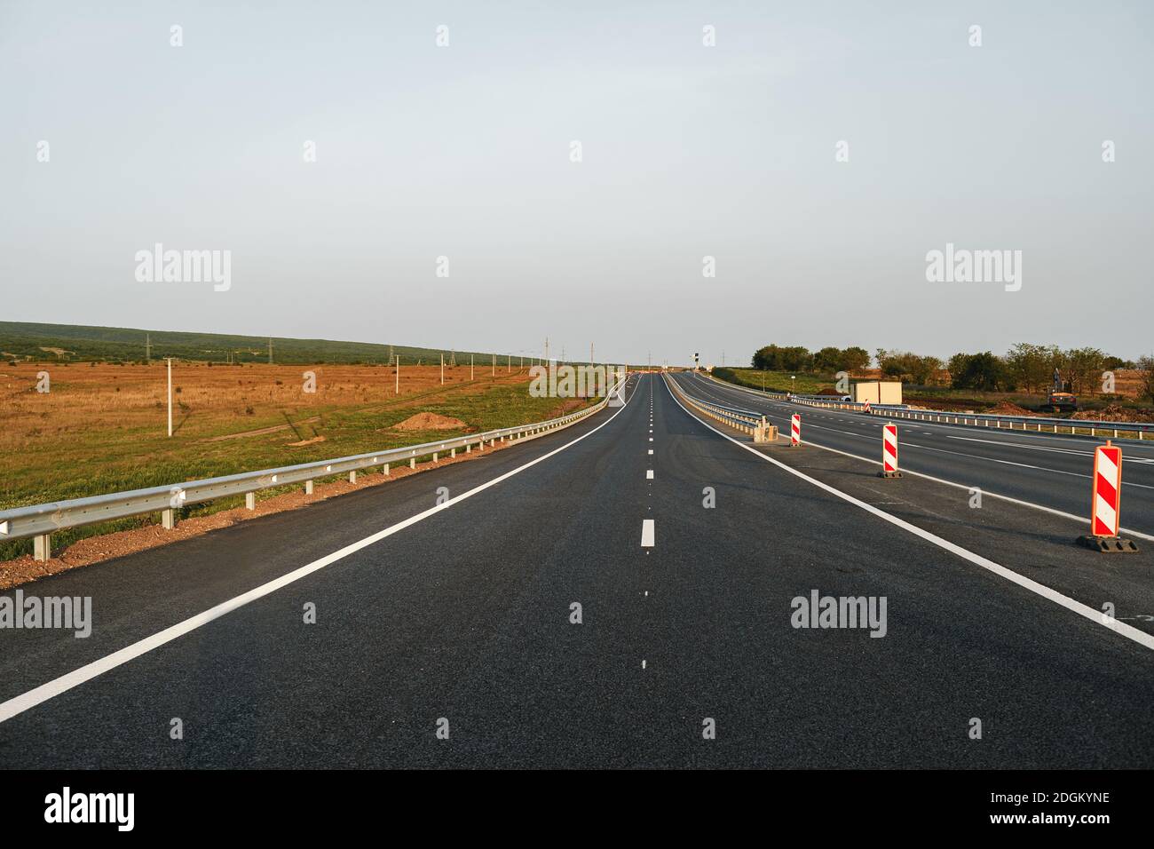 Empty highway with asphalt road and cloudy sky Stock Photo - Alamy