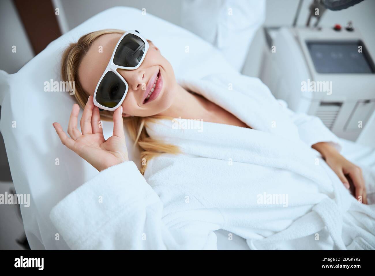 Joyful female patient relaxing before the procedure Stock Photo - Alamy
