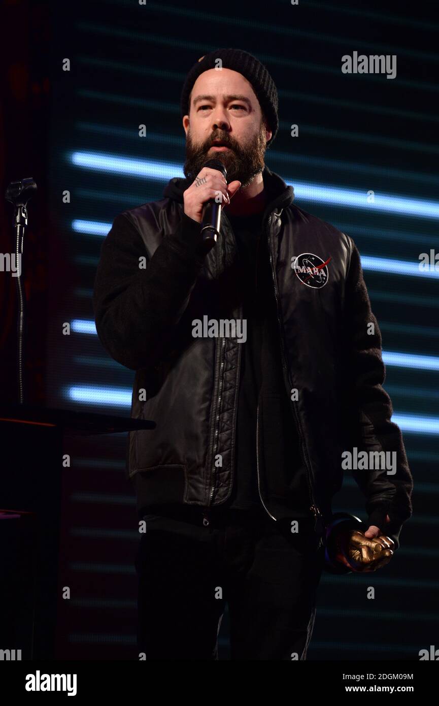 Daniel P Carter presents the NME Innovation Award on stage during the ...