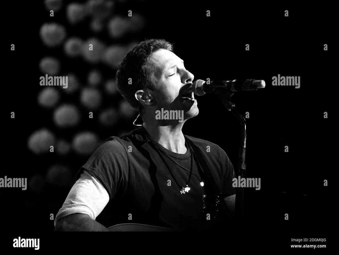 Chris Martin of Coldplay performing at the NME Awards 2016 with Austin ...