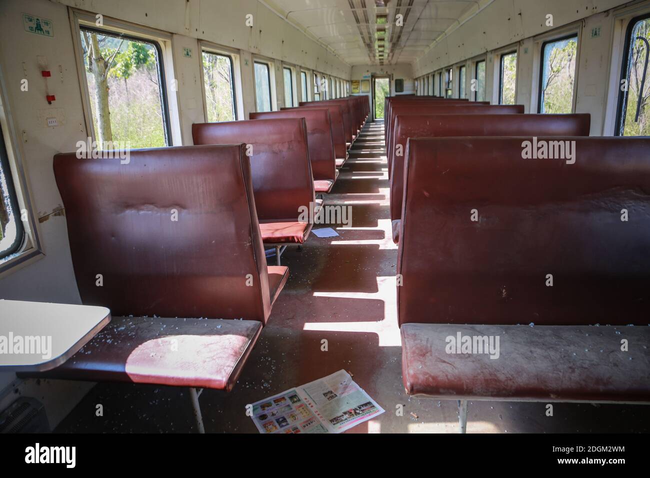 There are piles of abandoned green-skinned trains on the train ...