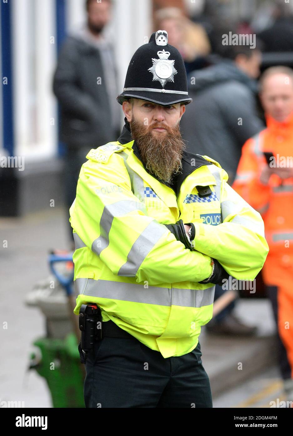 A bearded policeman provides security as the Duchess of Cambridge opens ...