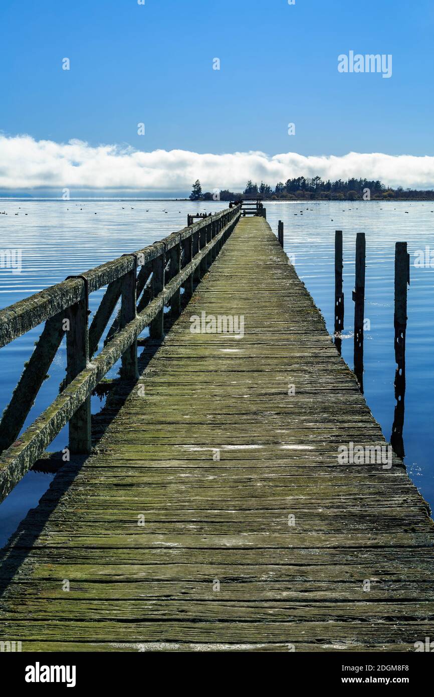 The historic old Tokaanu Wharf, extending far into the waters of Lake ...