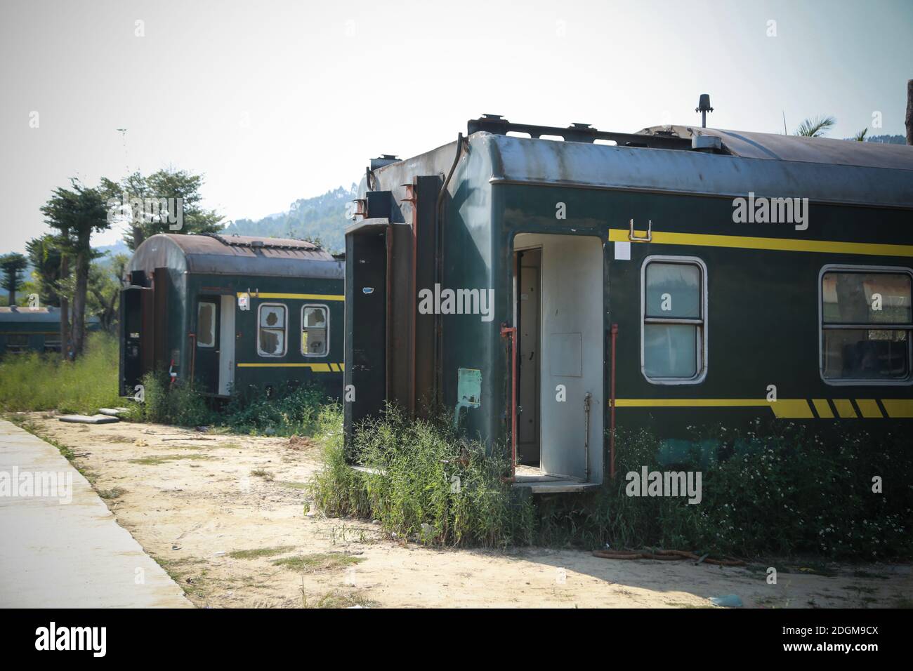 There are piles of abandoned green-skinned trains on the train ...
