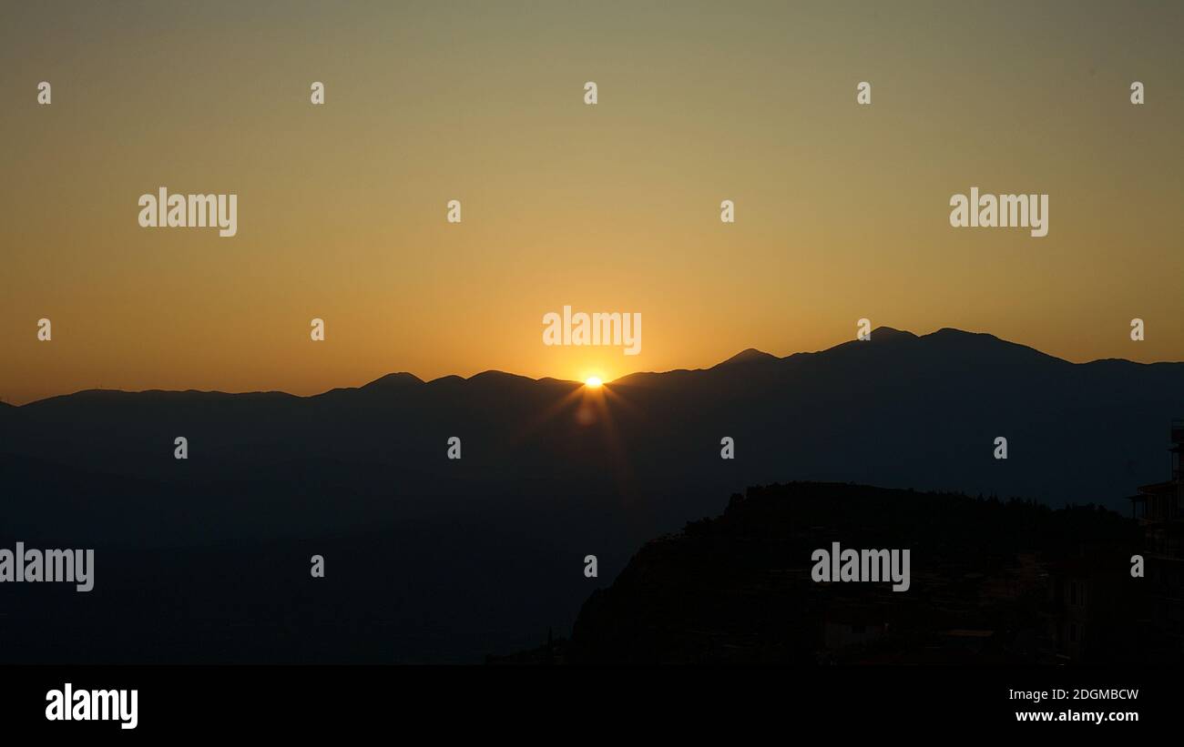 An idyllic sunset from Delphi, Greece - perfect for wallpaper Stock ...