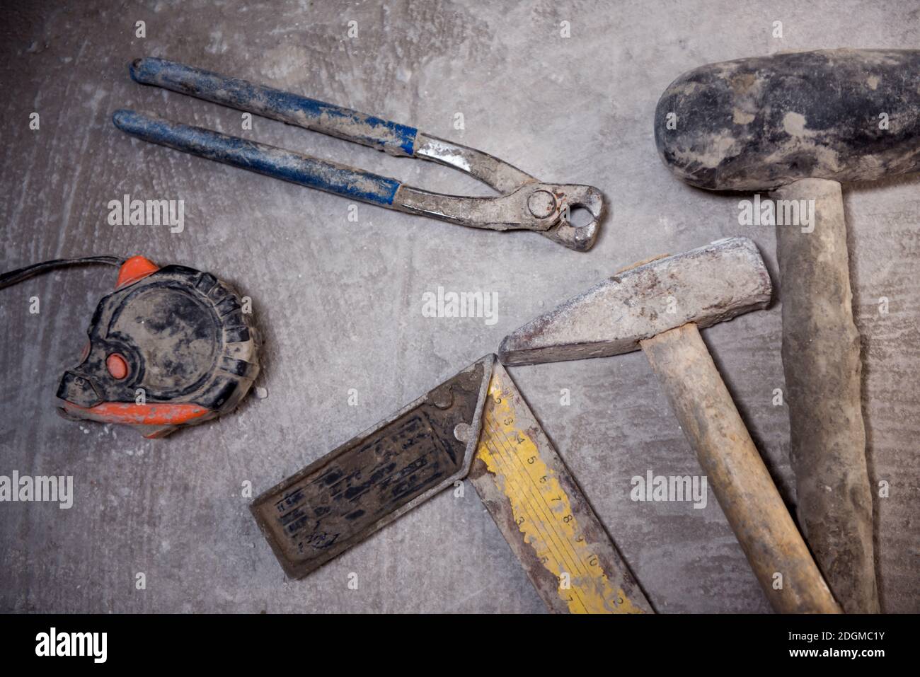 Set of hand working tools on concrete background Stock Photo - Alamy