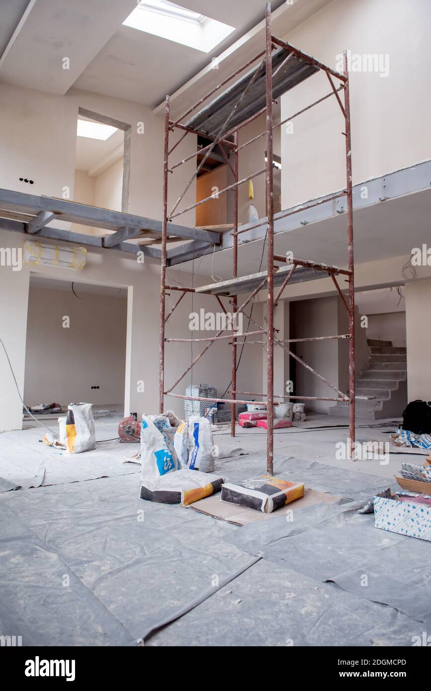 Interior of construction site with scaffolding Stock Photo - Alamy