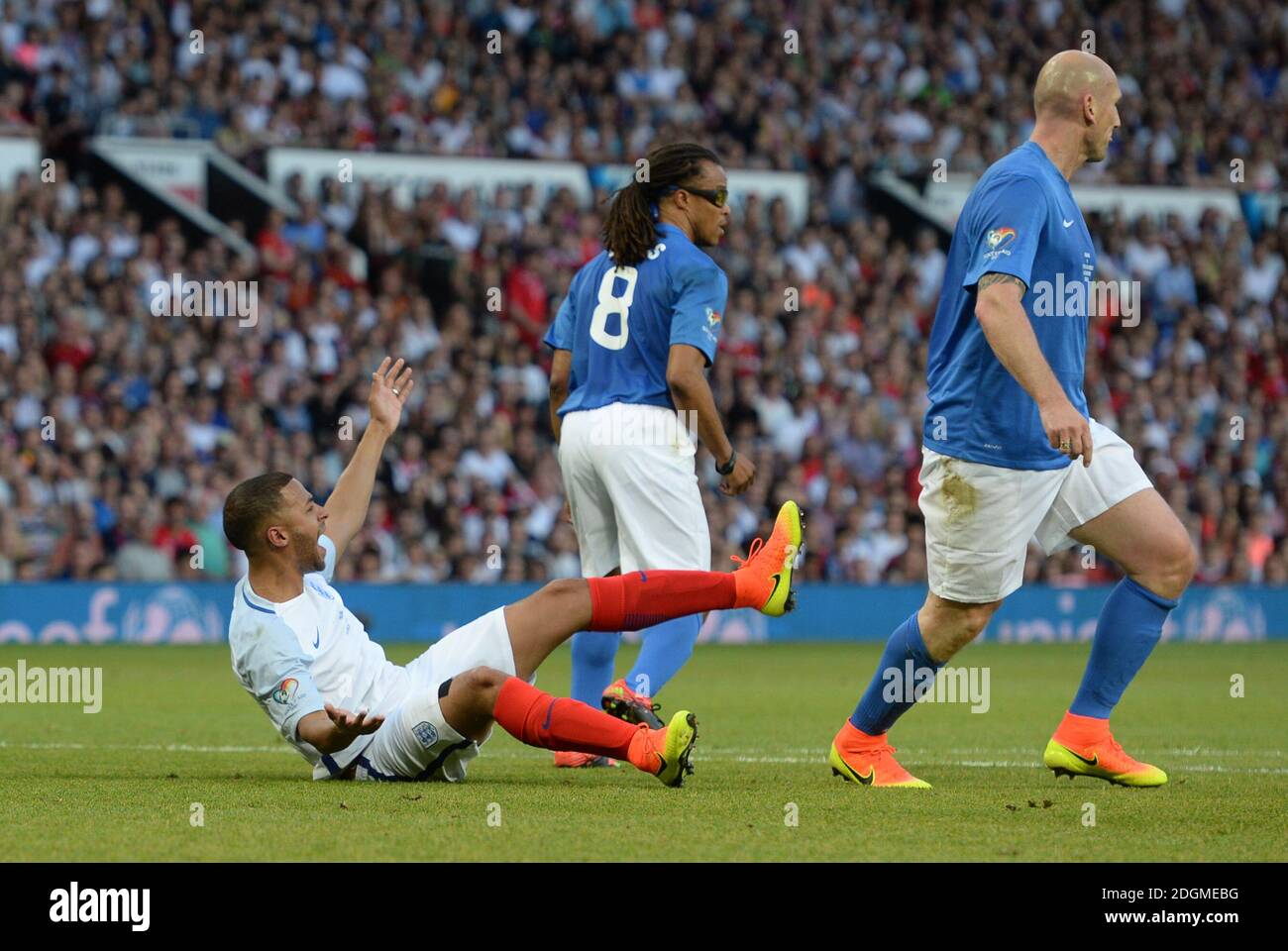 Marvin Humes and Jaap Stam battle for the ball during Soccer Aid 2016 ...