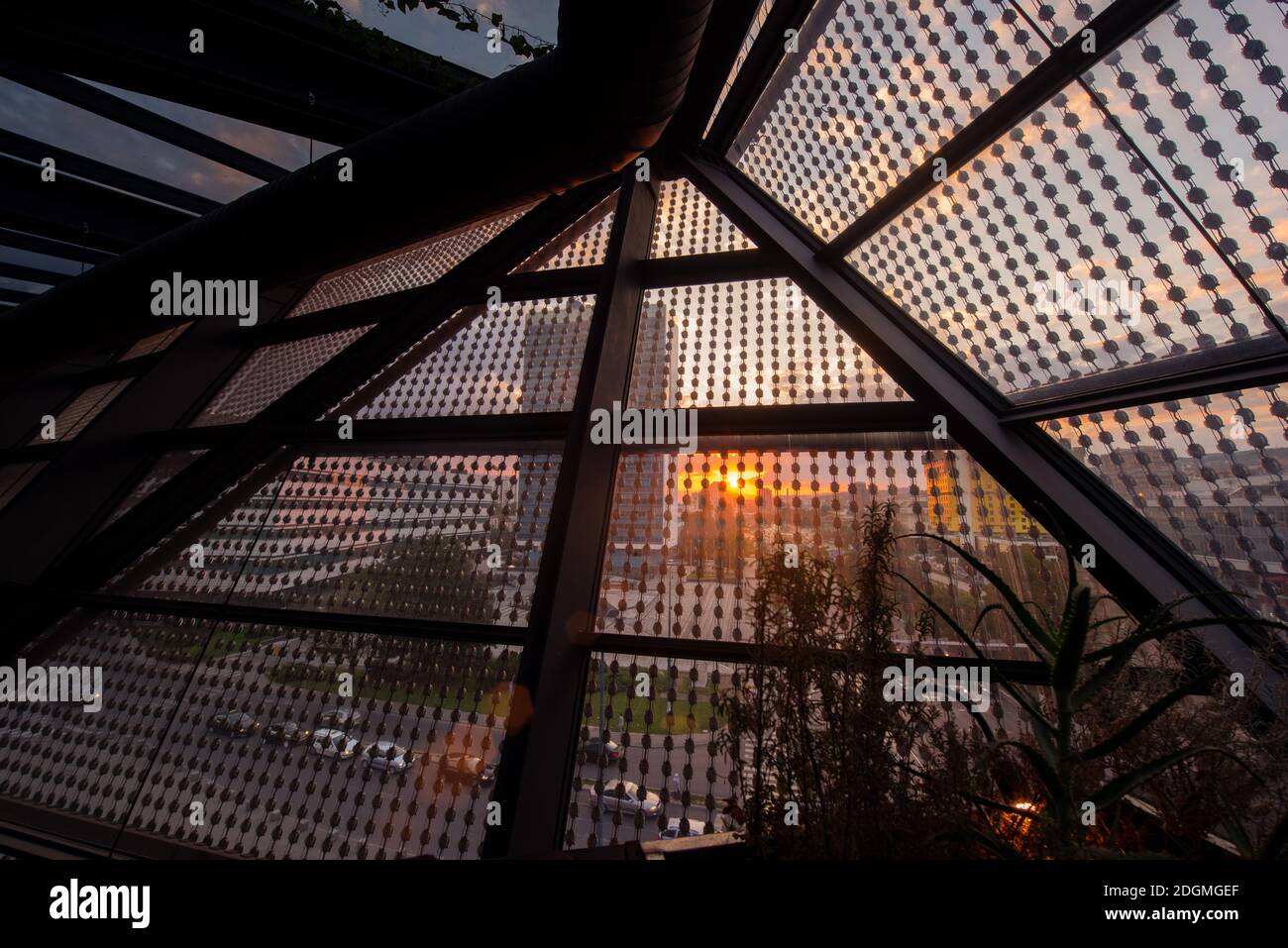 Sunset through a glass roof Stock Photo - Alamy