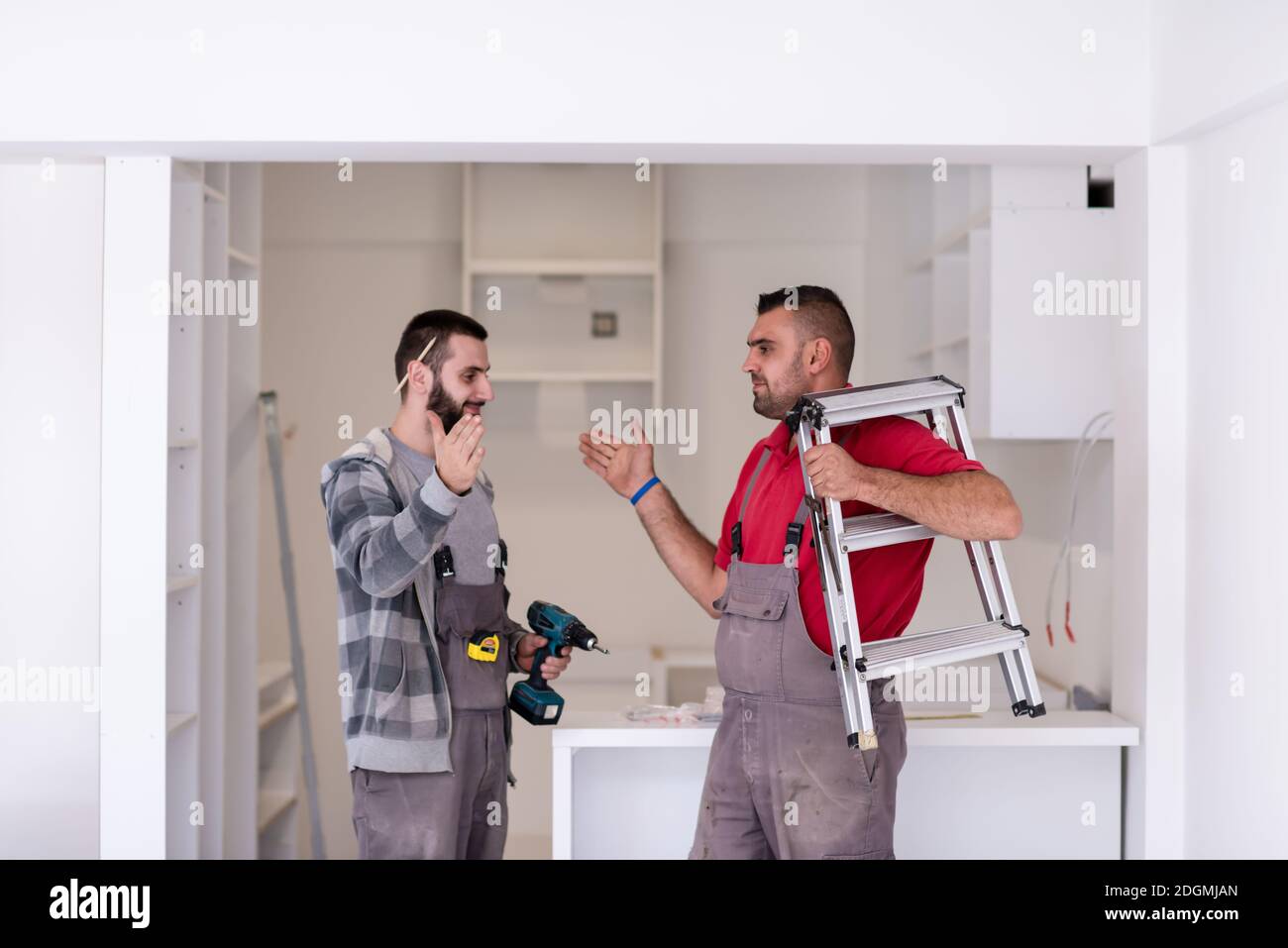 Workers giving high five to each other Stock Photo - Alamy