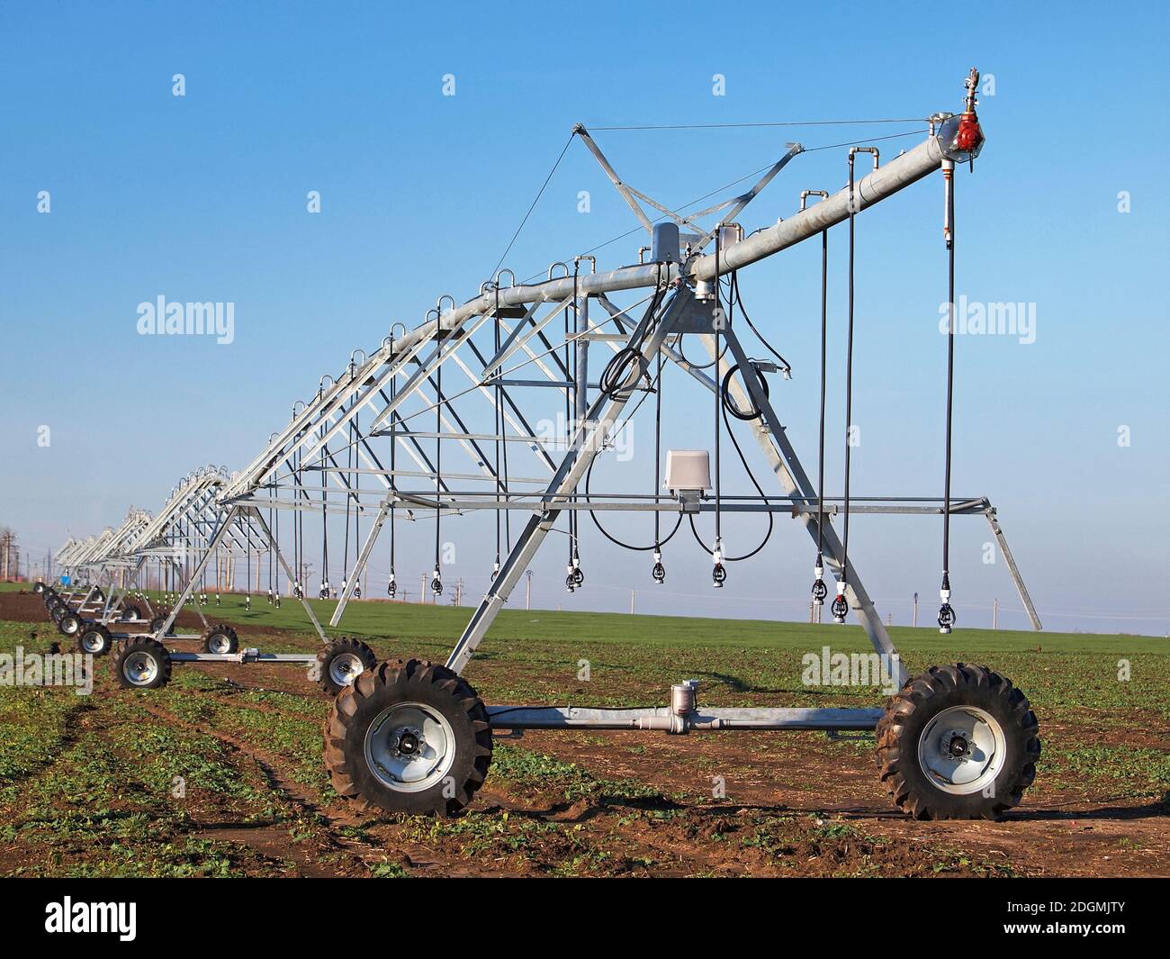 Irrigation system on wheels on the field Stock Photo - Alamy
