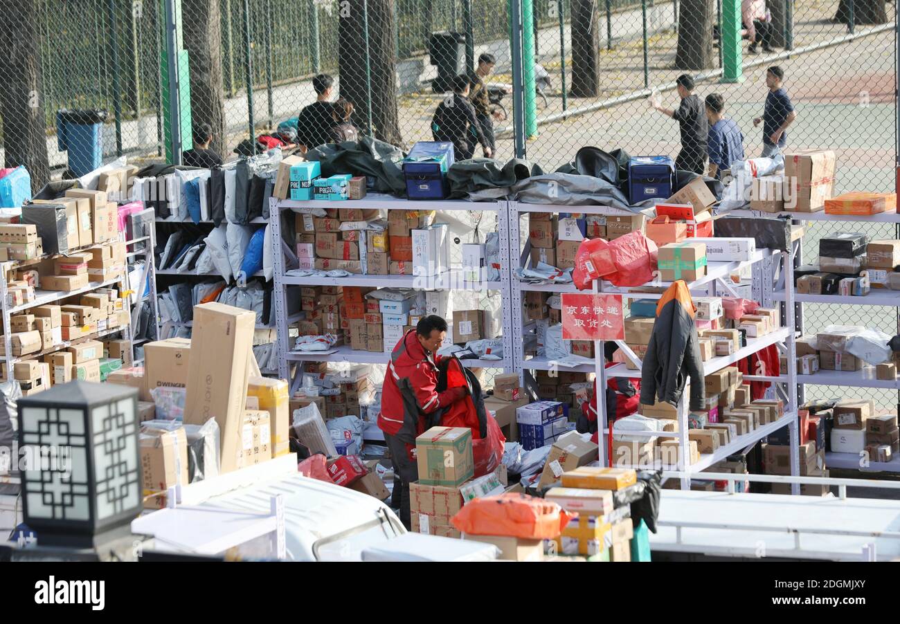 Aerial view of school staff sorting and arranging deliveries at a ...