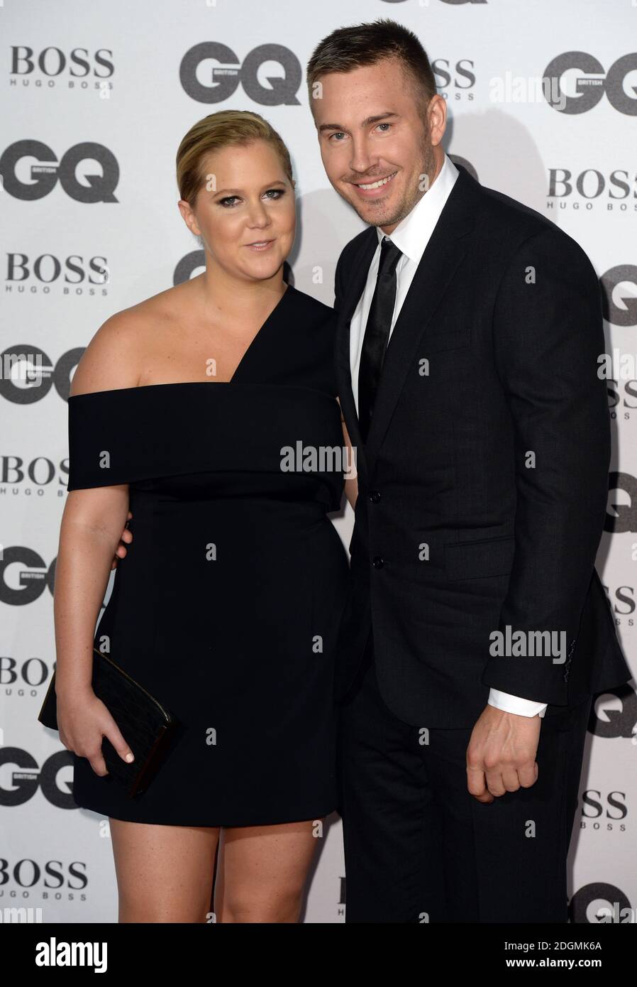 Amy Schumer and Ben Hanisch attending the GQ Men of the Year Awards ...