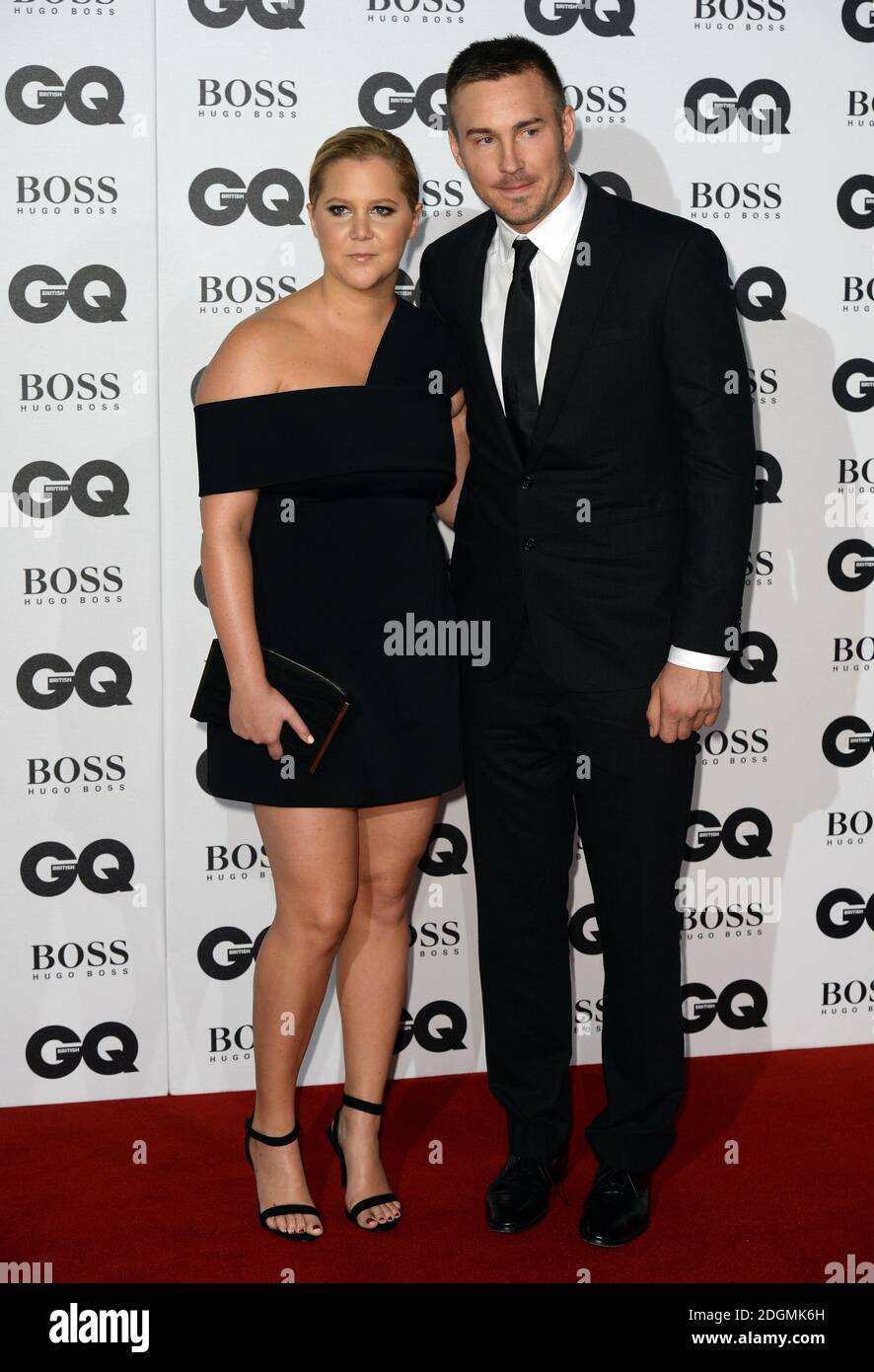 Amy Schumer and Ben Hanisch attending the GQ Men of the Year Awards ...