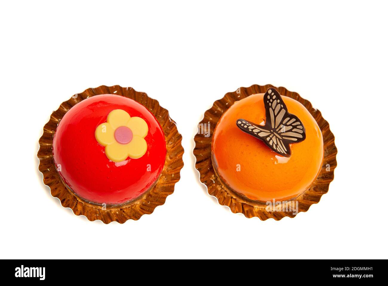 Two delicious looking small round cakes isolated on a white background ...