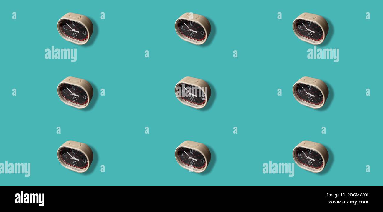 Mosaic of analog retro alarm clocks on cyan background. Multiplication ...