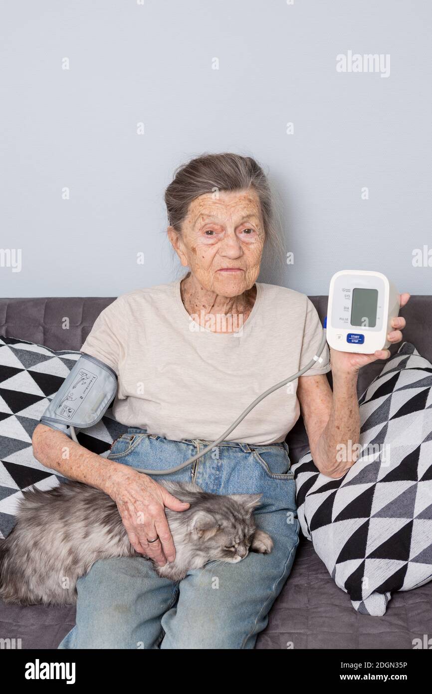 The topic very old person and monitor health. senior Caucasian woman ...