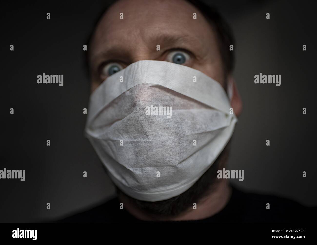 Man with face mask - fear of infection Stock Photo - Alamy