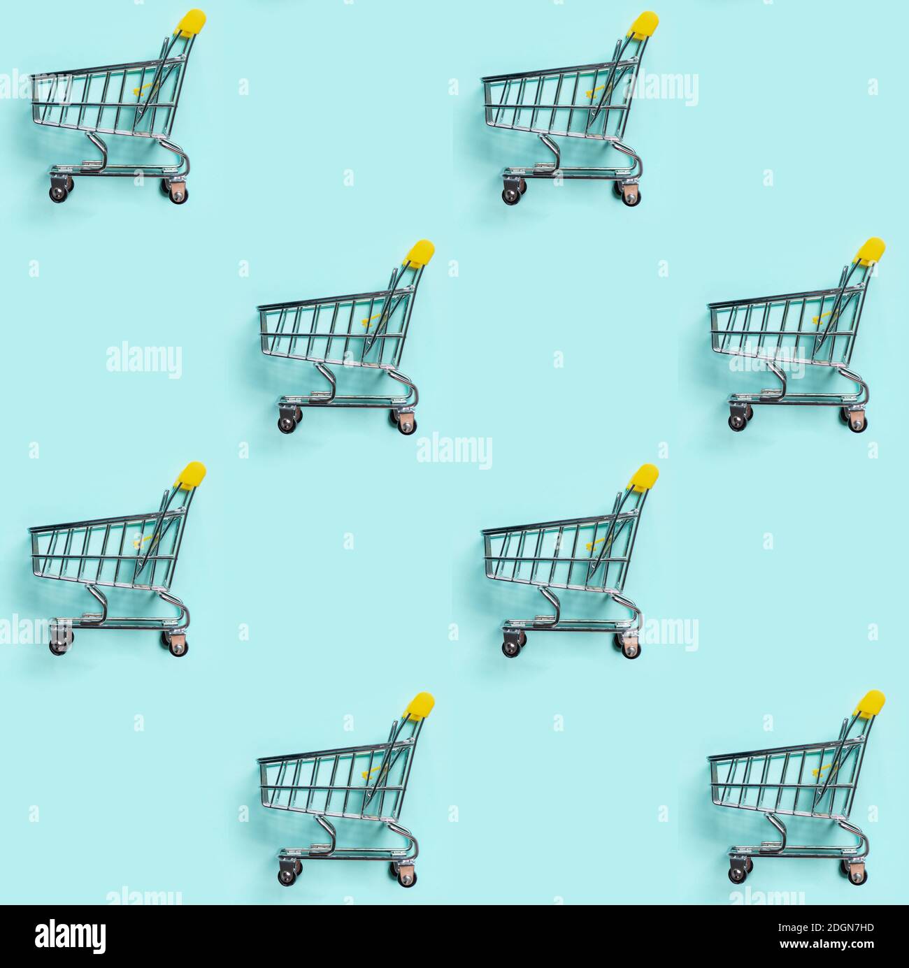 Shopping cart staggered on blue. Seamless pattern Stock Photo - Alamy