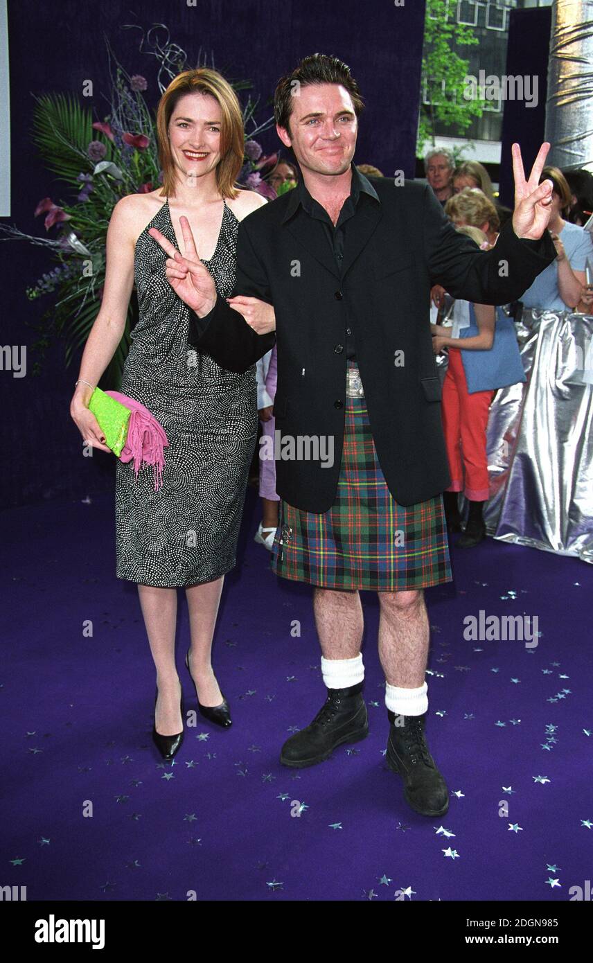 Alex Ferns and wife out in London. Full length, kilt, v sign. Â©Doug ...