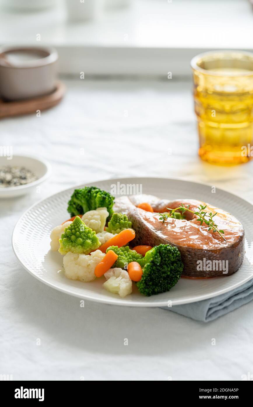 Steam salmon and vegetables, Paleo, keto, fodmap, dash diet. Side view ...