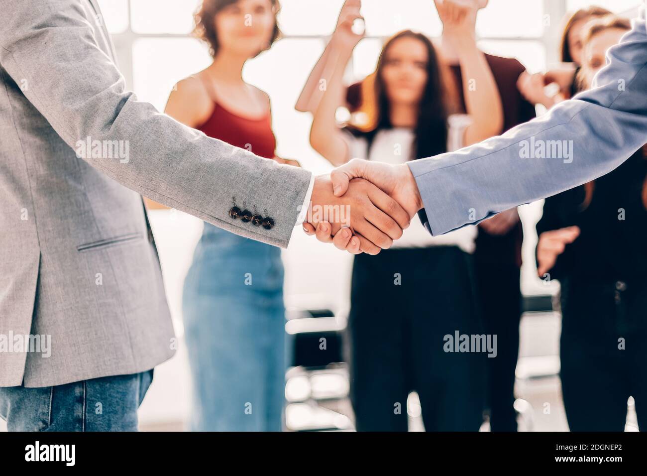 young business people shaking hands with each other Stock Photo - Alamy