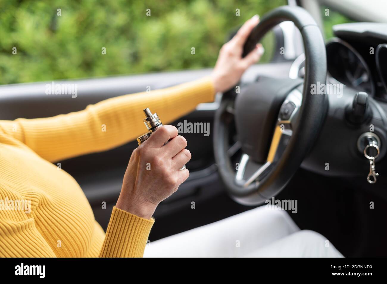 Woman smoking cigarette driving hi-res stock photography and images - Alamy