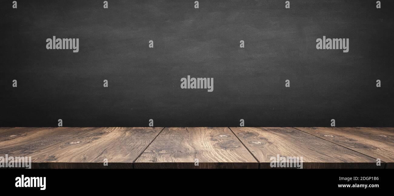 Rustic wooden table with grey background Stock Photo - Alamy