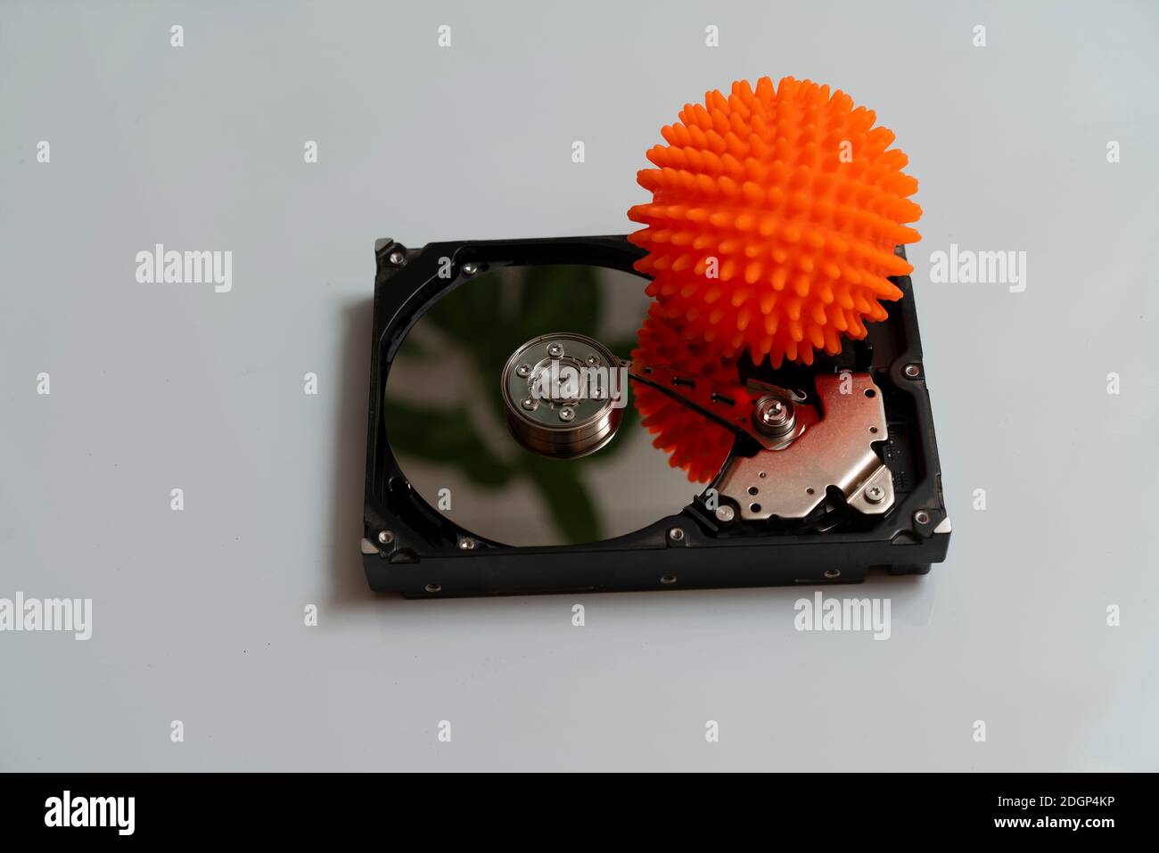 Concept, data infected by a virus. Disassembled hard drive with virus ...