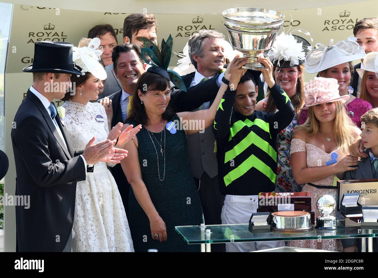 Jockey John Velazquez lifts the trophy after winning the King's Stand ...