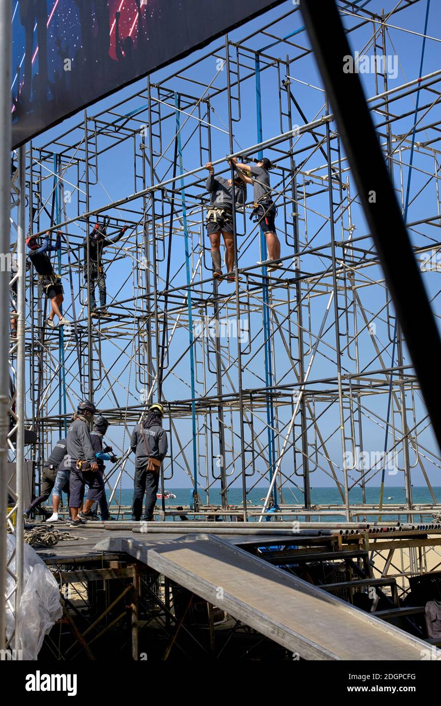Scaffolders erecting scaffolding in preparation of a stage show ...