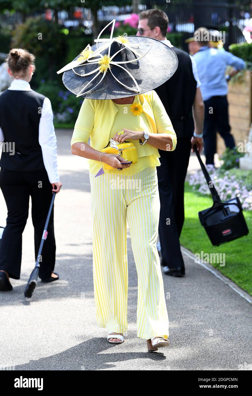 A female racegoer wears trousers after the relaxing of the dress code ...