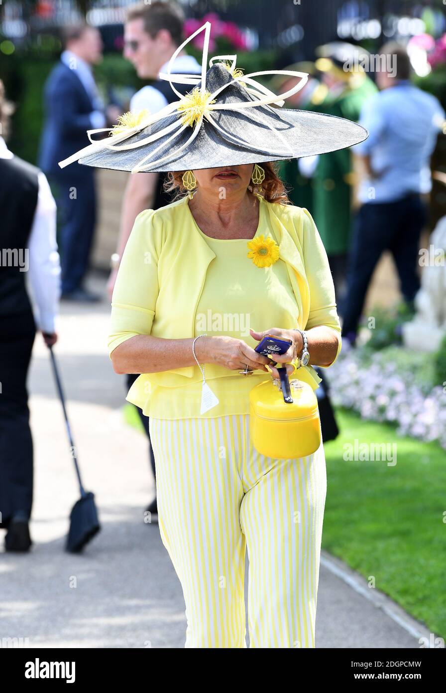 A female racegoer wears trousers after the relaxing of the dress code ...