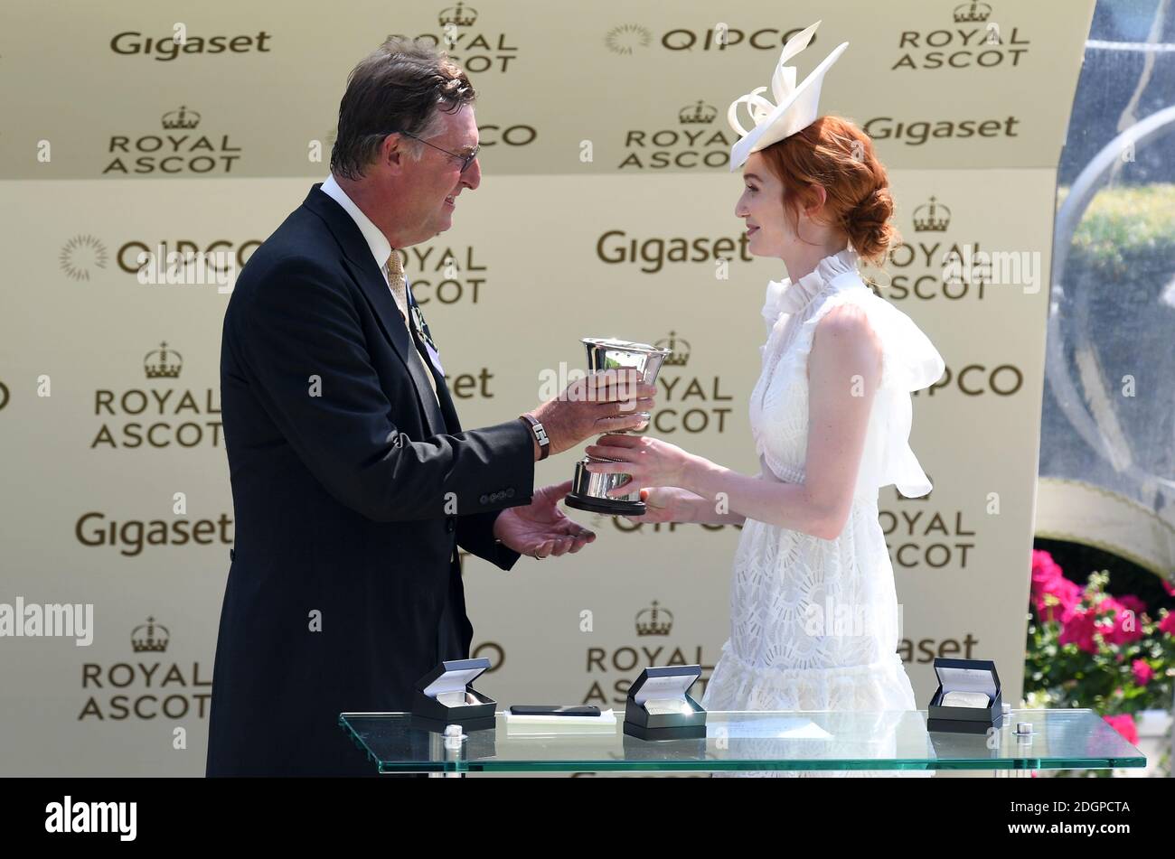 Eleanor Tomlinson presents a trophy to Ted Voute during day two of ...