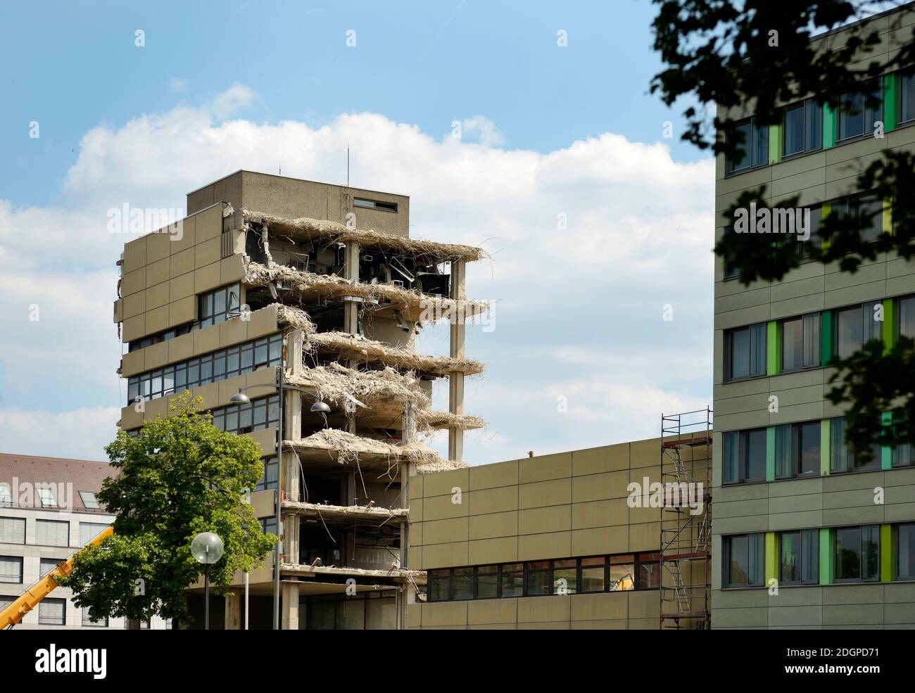 Partially demolished building in office area Stock Photo - Alamy