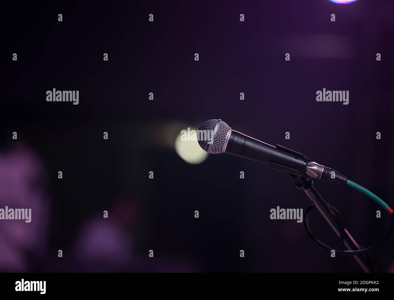 Electric microphone on stage Stock Photo - Alamy