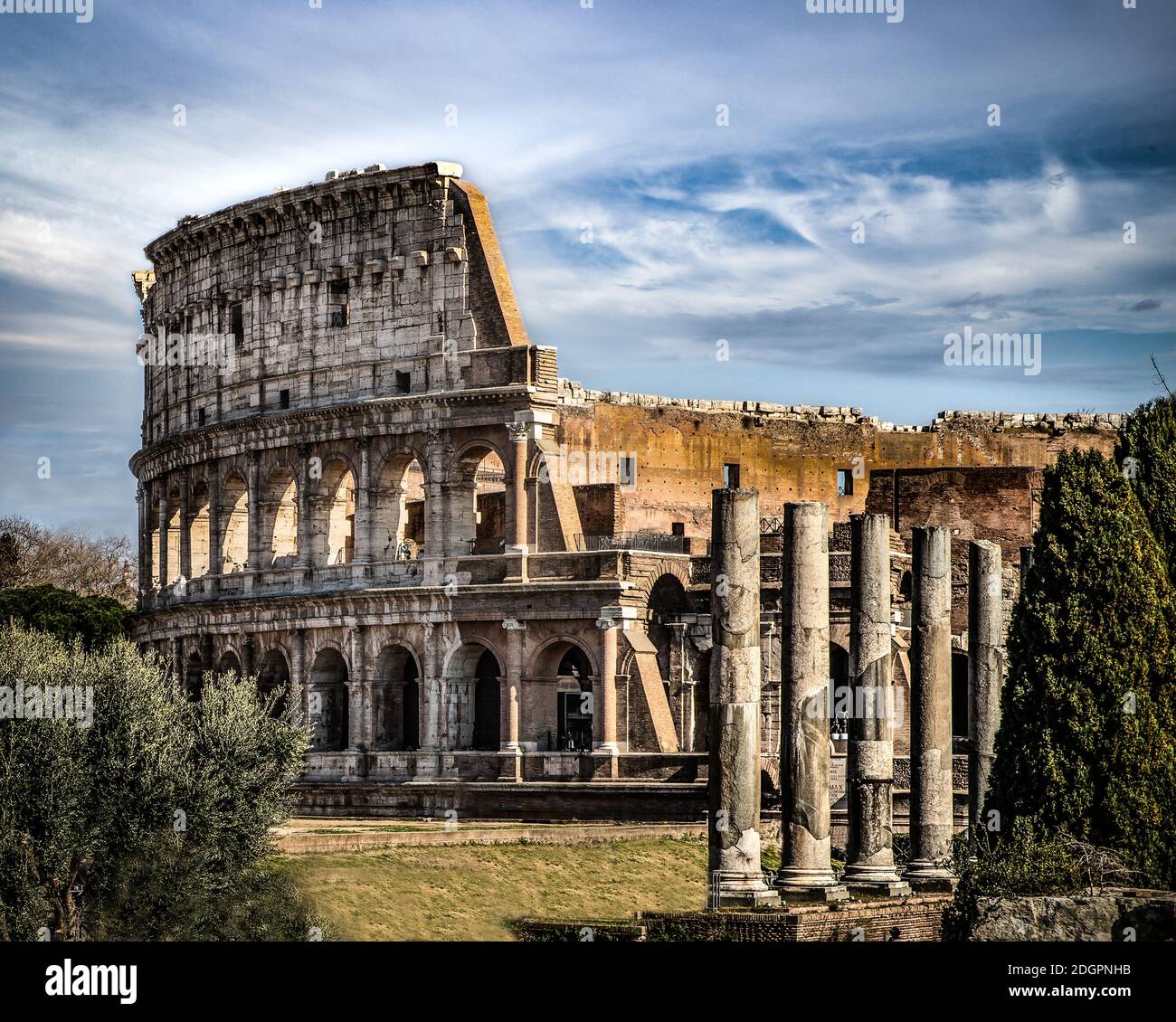 A view of the outside of the Roman Colosseum in Rome under a cloudy sky ...