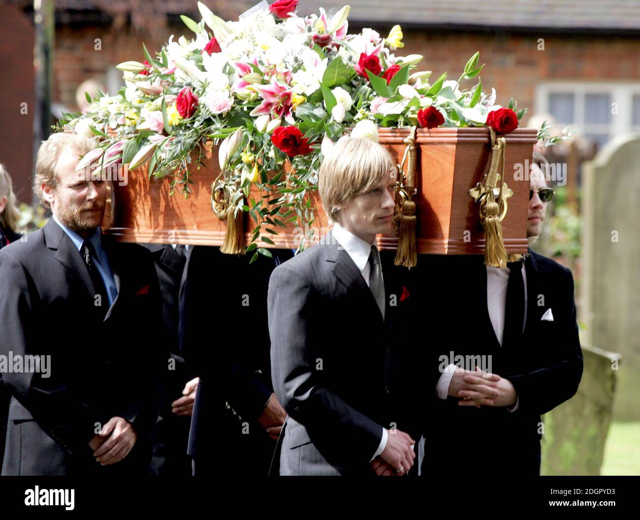 Crispian Mills (front ) carrying the coffin of his late grandfather ...