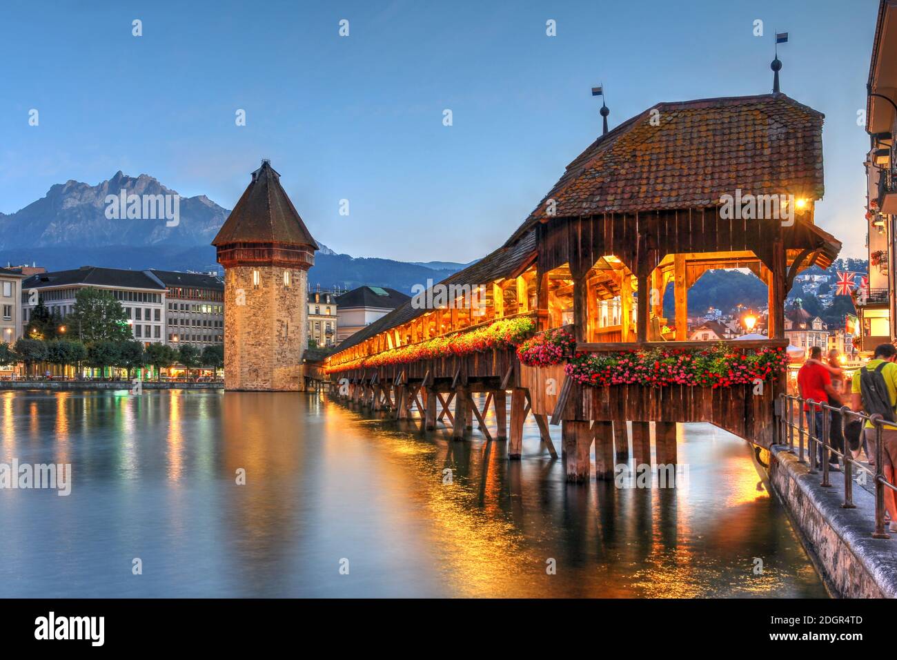 Evening scene with the picturesque Chapel Bridge over the Reuss River ...